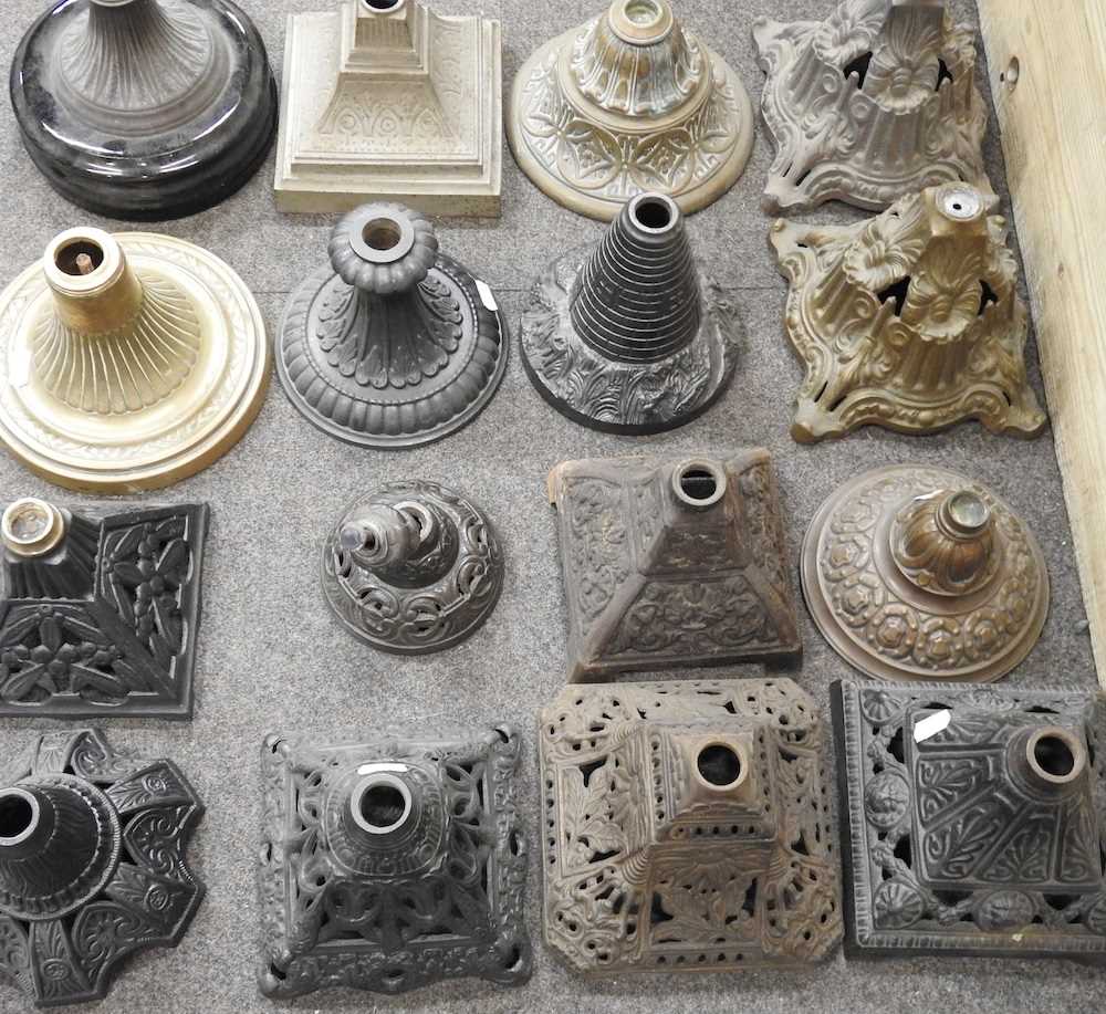 Lot 163 - A collection of cast iron oil lamp bases