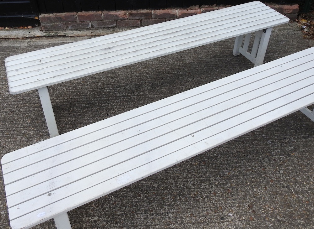 Lot 631 - A pair of white painted folding slatted