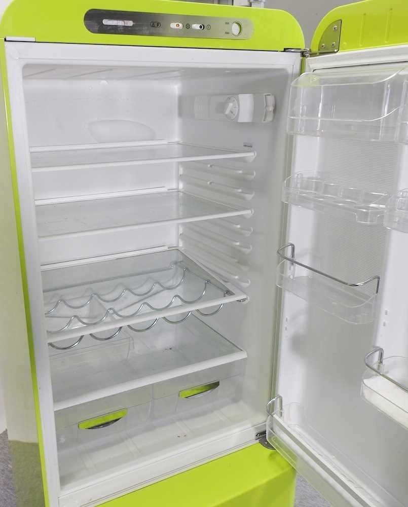 Lot 402 - A SMEG lime green fridge-freezer,