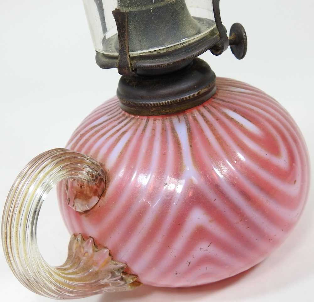 Lot 28 - A glass finger lamp
