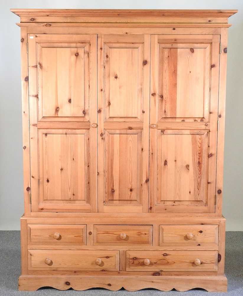 Lot 420 - A pine wardrobe