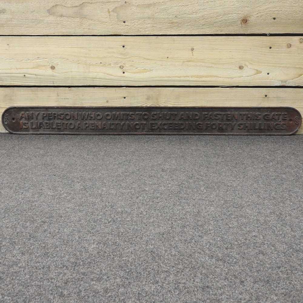 Lot 383 - A cast iron sign