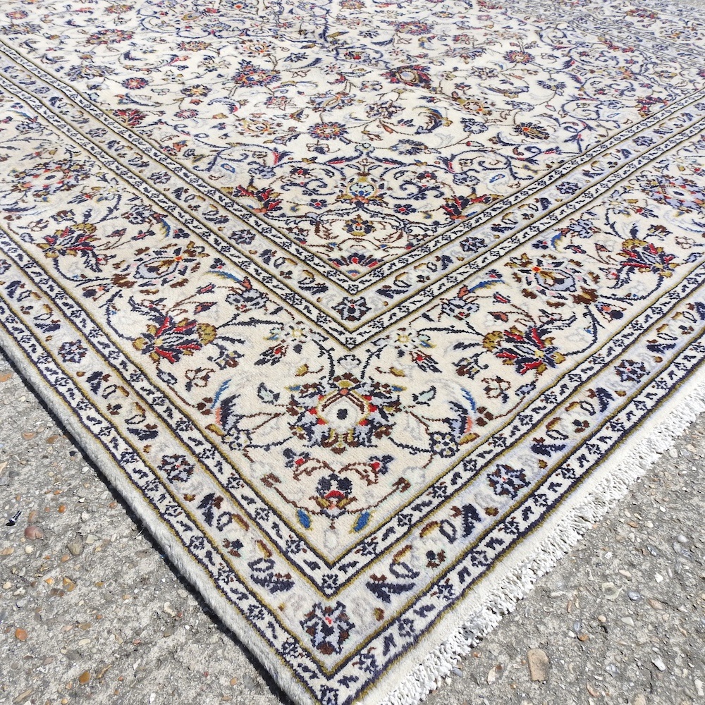 Lot 428 - A large Persian carpet