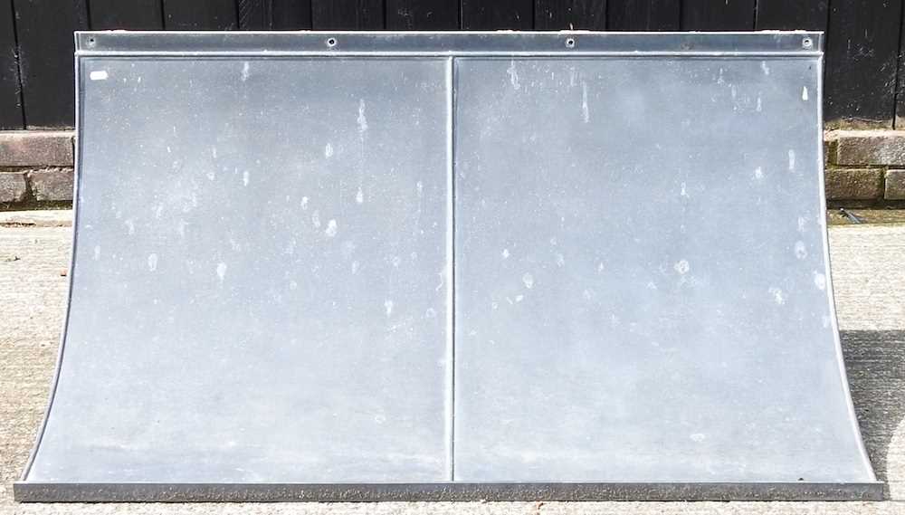 Lot 11 - A galvanised zinc porch door canopy, from