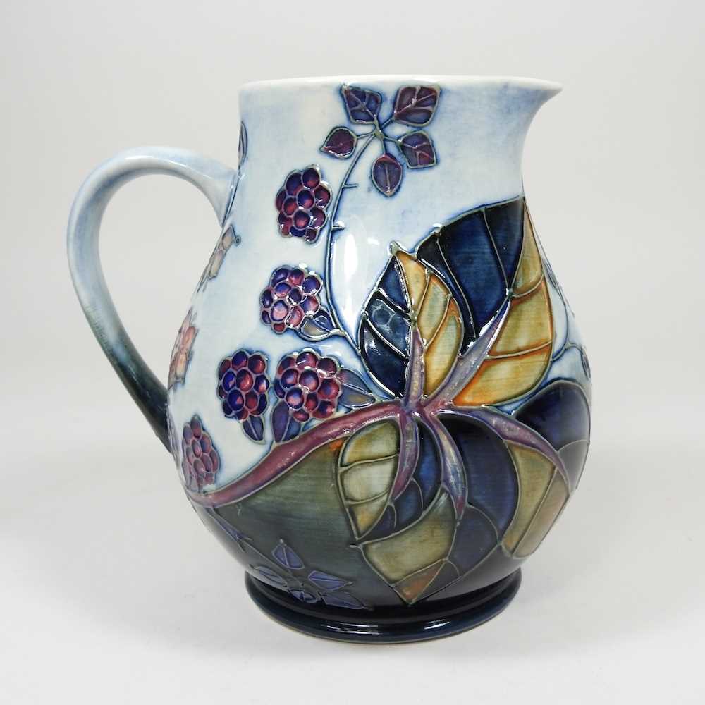 Lot 57 - A Moorcroft Bramble pattern pottery jug,