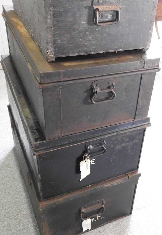 Lot 144 - Four black painted metal trunks