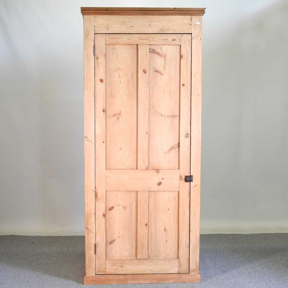 Lot 515 - An antique pine hall cupboard
