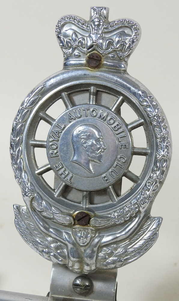 Lot 314 - A vintage car badge bar, displaying four