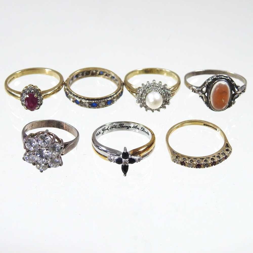 Lot 411 - A 9 carat gold, ruby and diamond half hoop