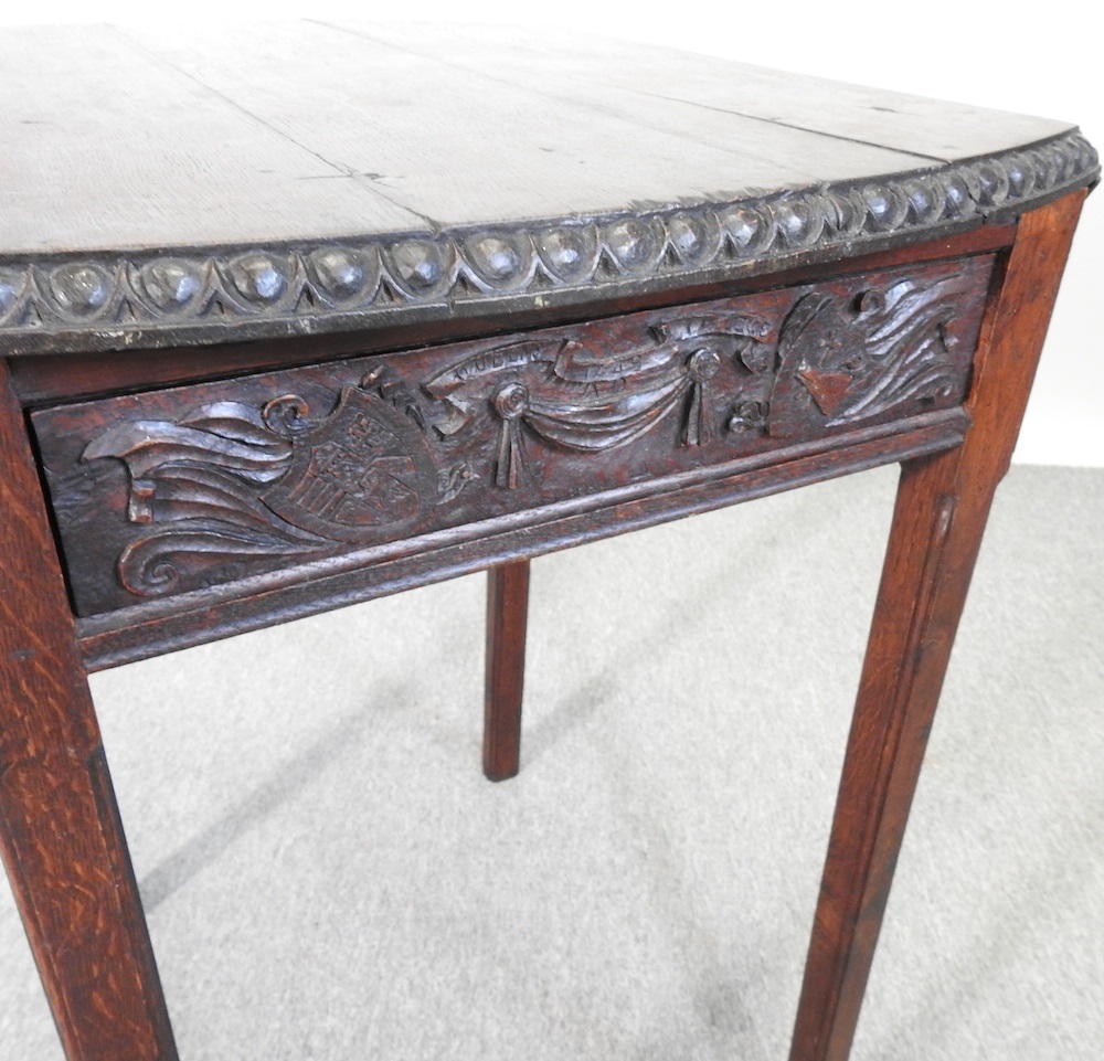 Lot 57 - A 19th century carved oak pembroke table,