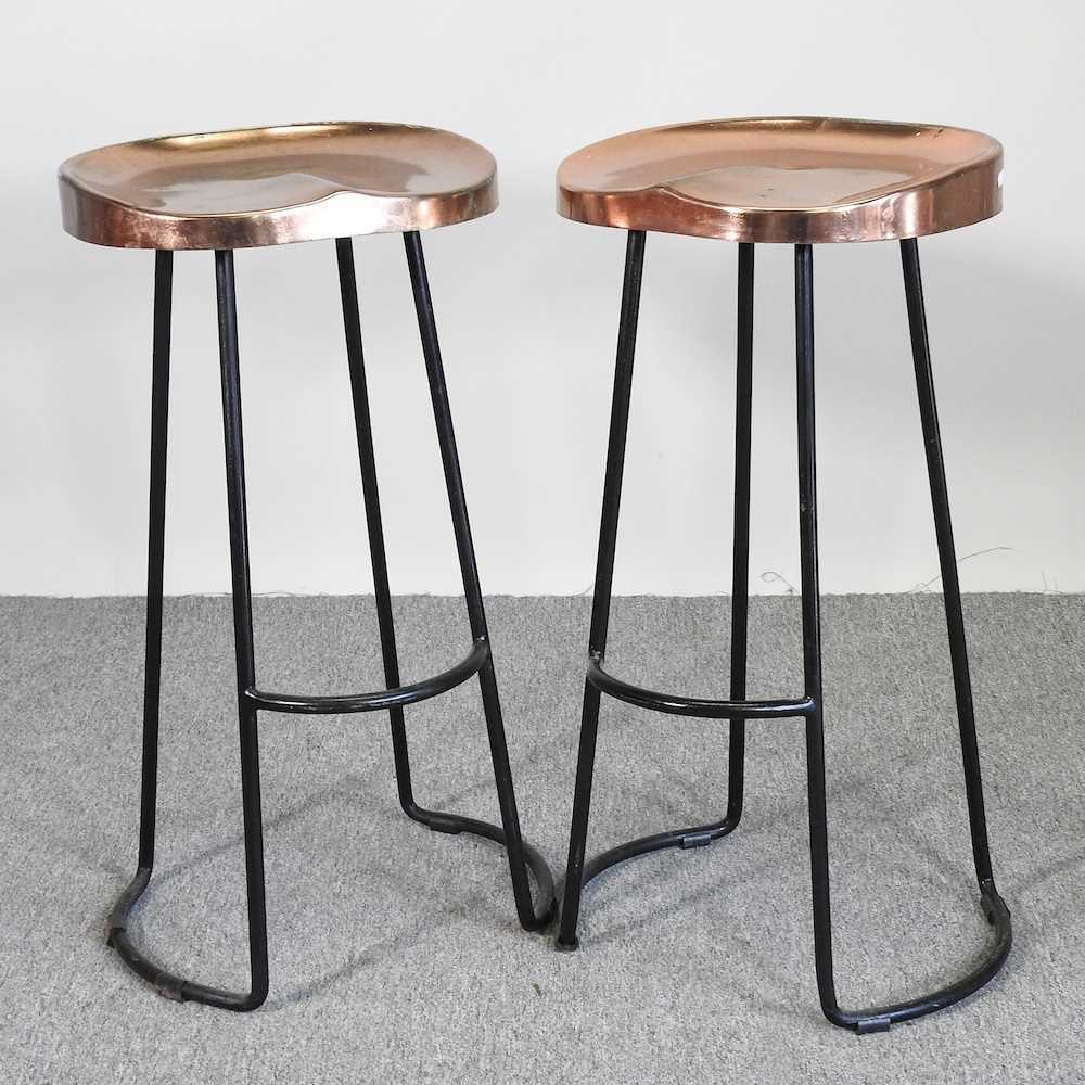 Lot 519 - A pair of black painted metal bar stools,