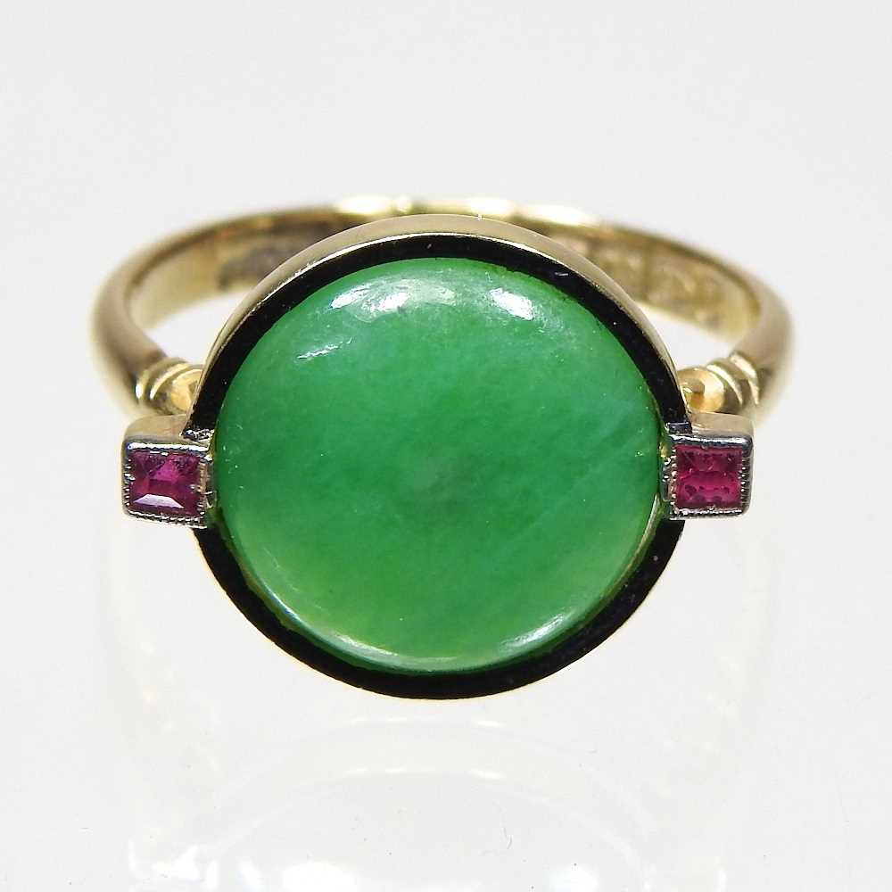Lot 386 - An 18 carat gold jade ring, set with two