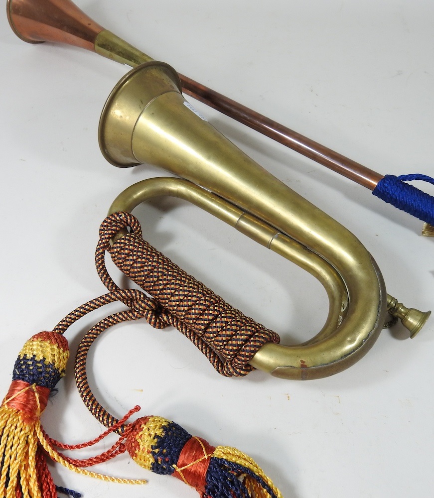 Lot 135 - A brass hunting horn, 73cm long, together