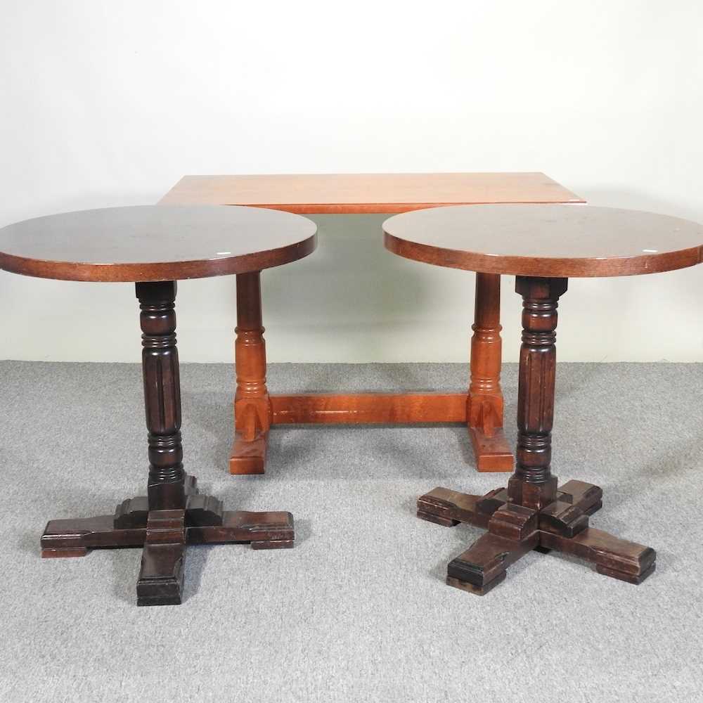 Lot 248 - A pair of circular oak pub tables, together