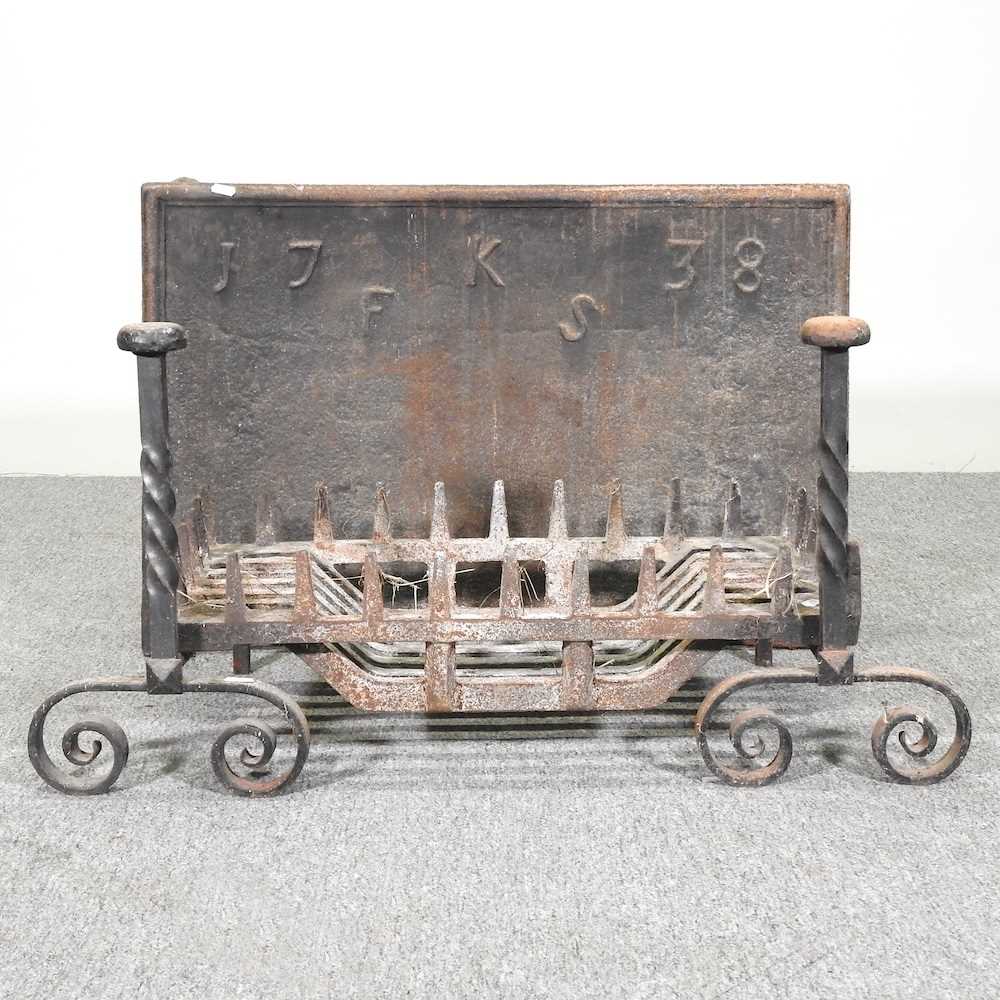 Lot 289 - A cast iron fire back, initialled FKS, dated