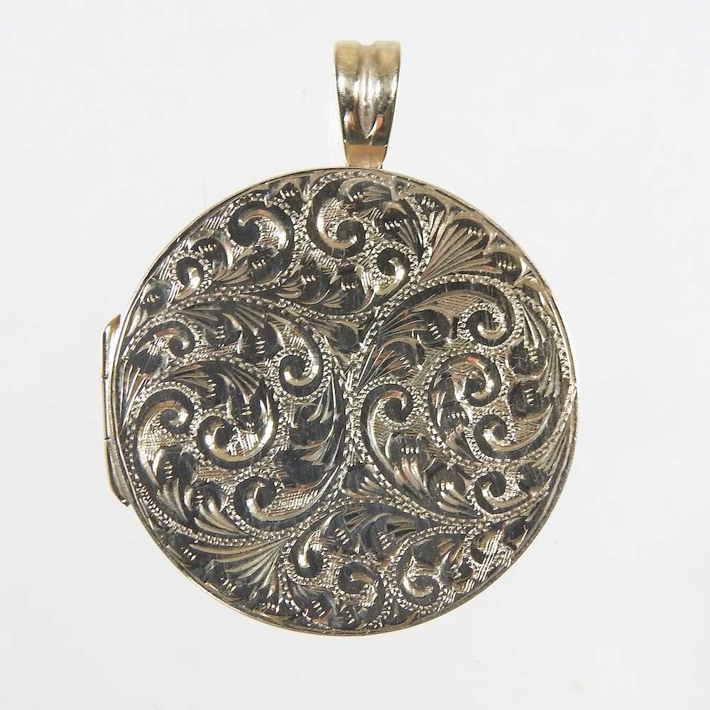 Lot 280 - A gilt locket, of hinged circular shape,