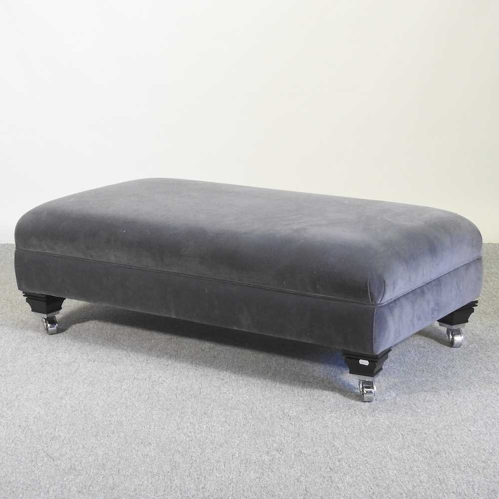 Lot 476 - A modern grey upholstered footstool, on