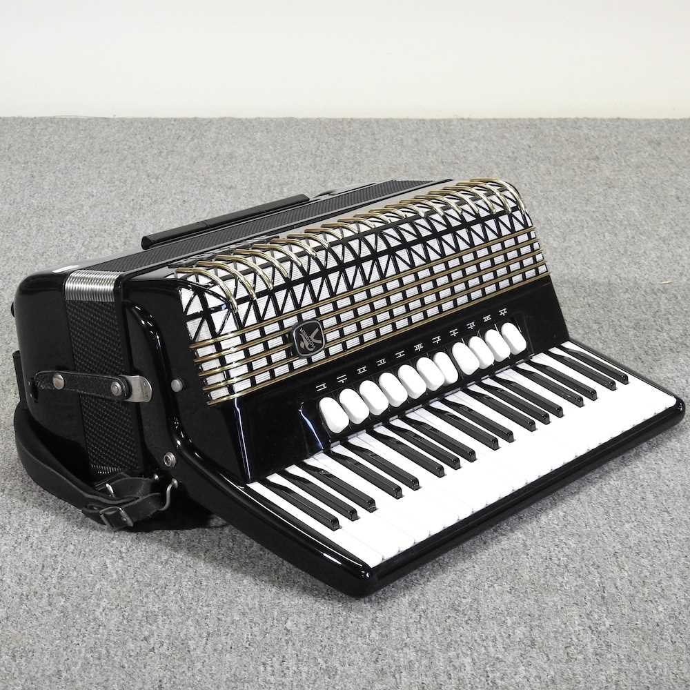 Lot 558 - A Hohner Atlantic IV accordion, in a hard