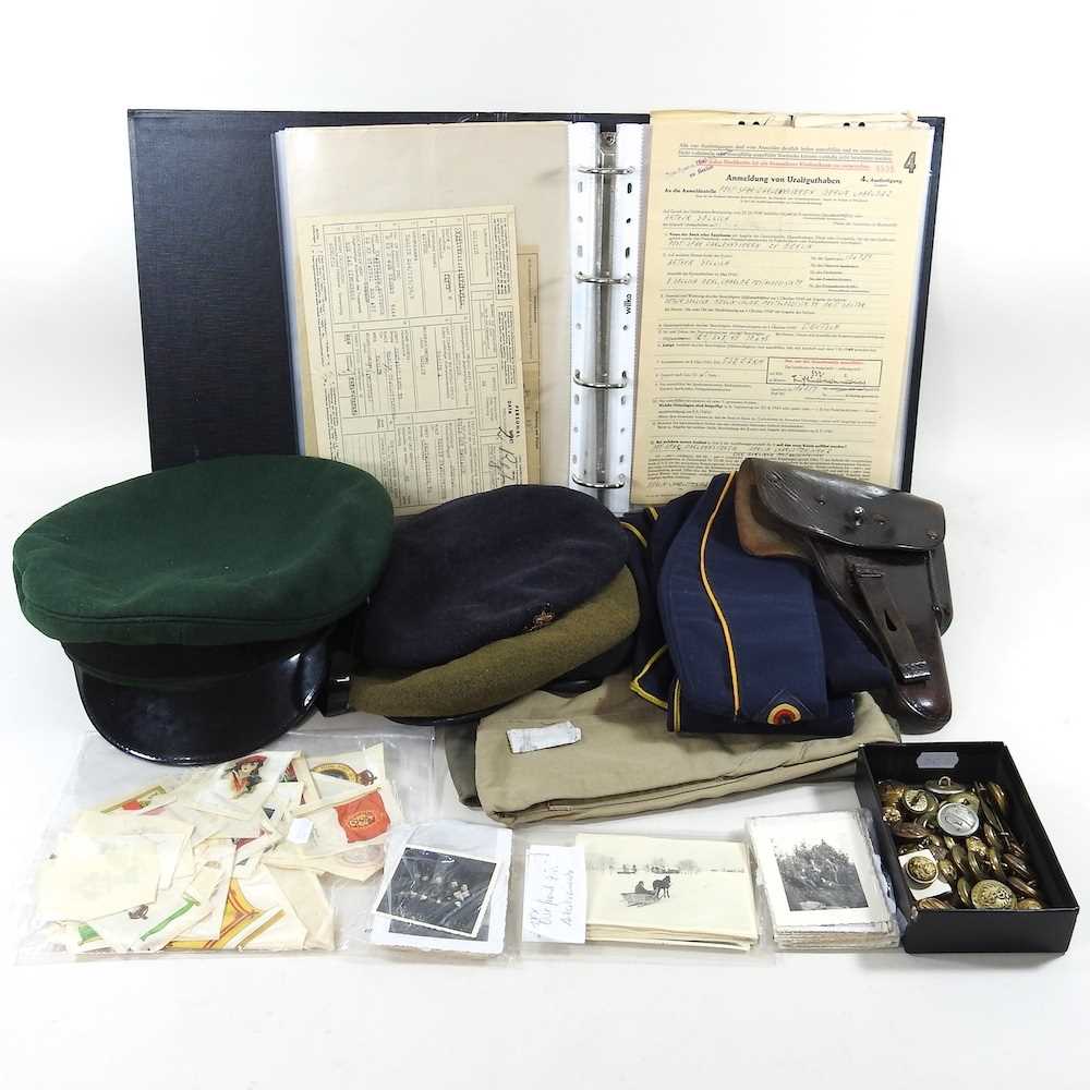 Lot 175 - A collection of militaria, to include caps,
