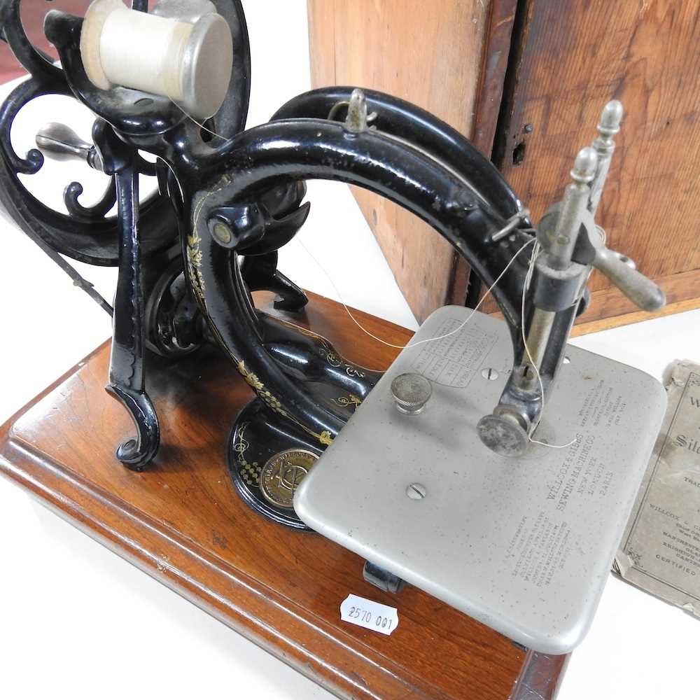 Lot 22 - A 19th century Willcox & Gibbs sewing machine,