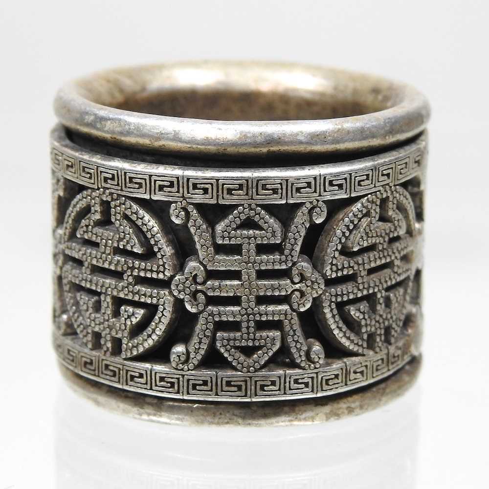 Lot 146 - A Chinese white metal archer's ring, of