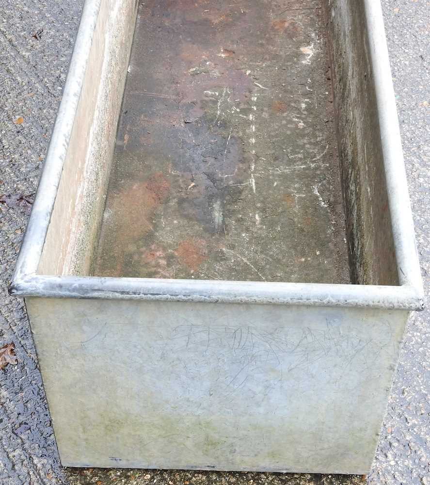 Lot 14 - A large galvanised trough, 182cm wide