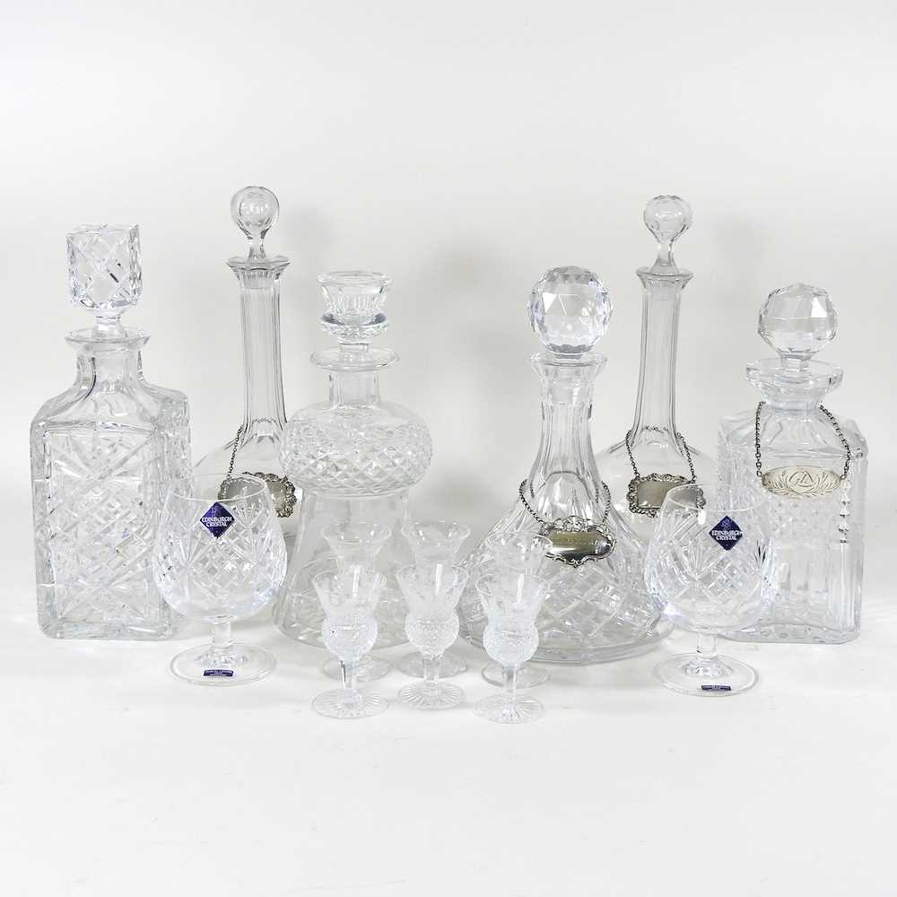 Lot 465 - A collection of four silver decanter labels,