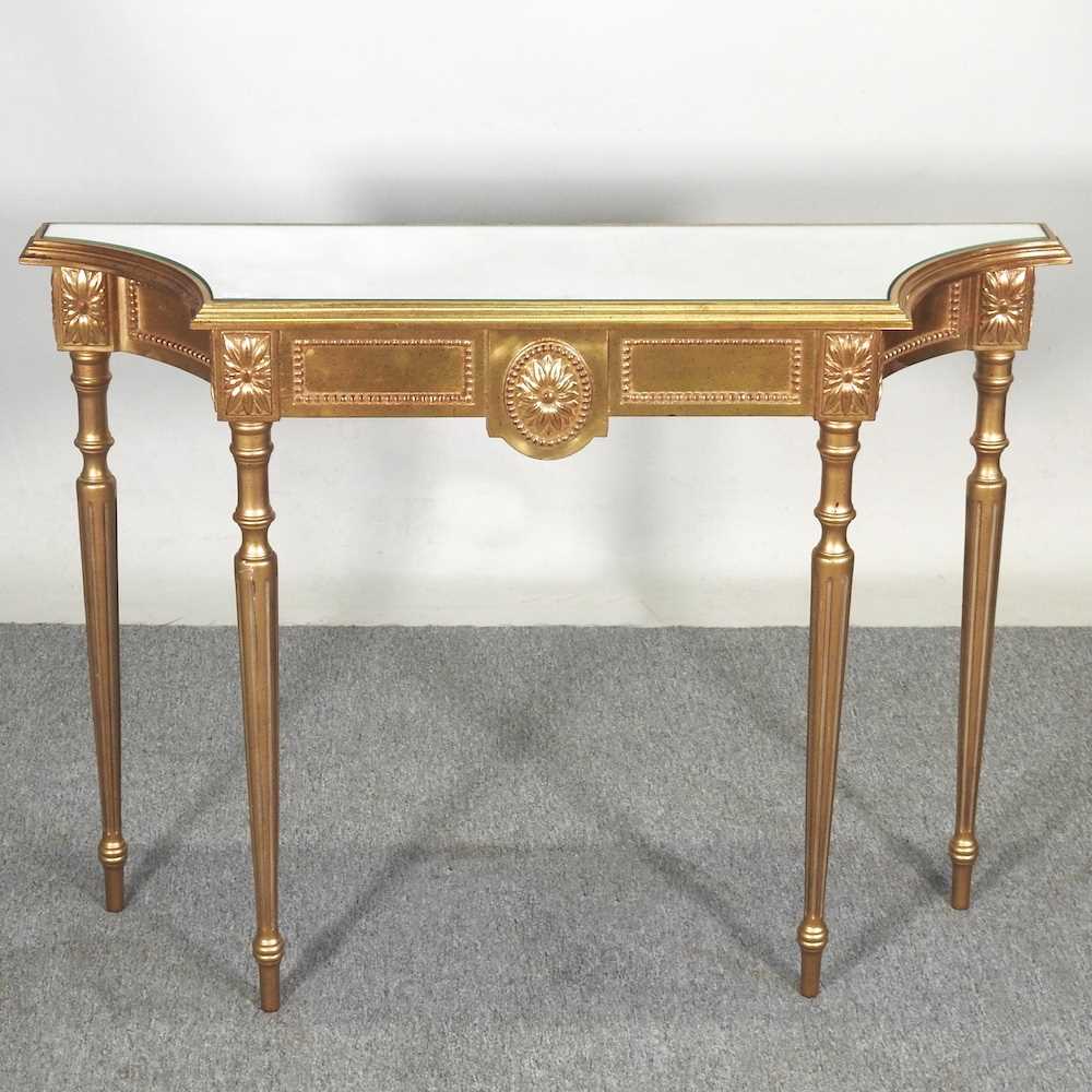 Lot 231 - A modern gilt painted pier table, with a