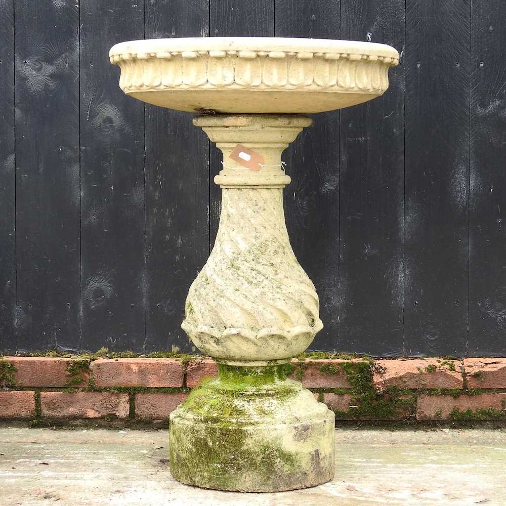 Lot 457 - A large cast stone bird bath, 90cm high