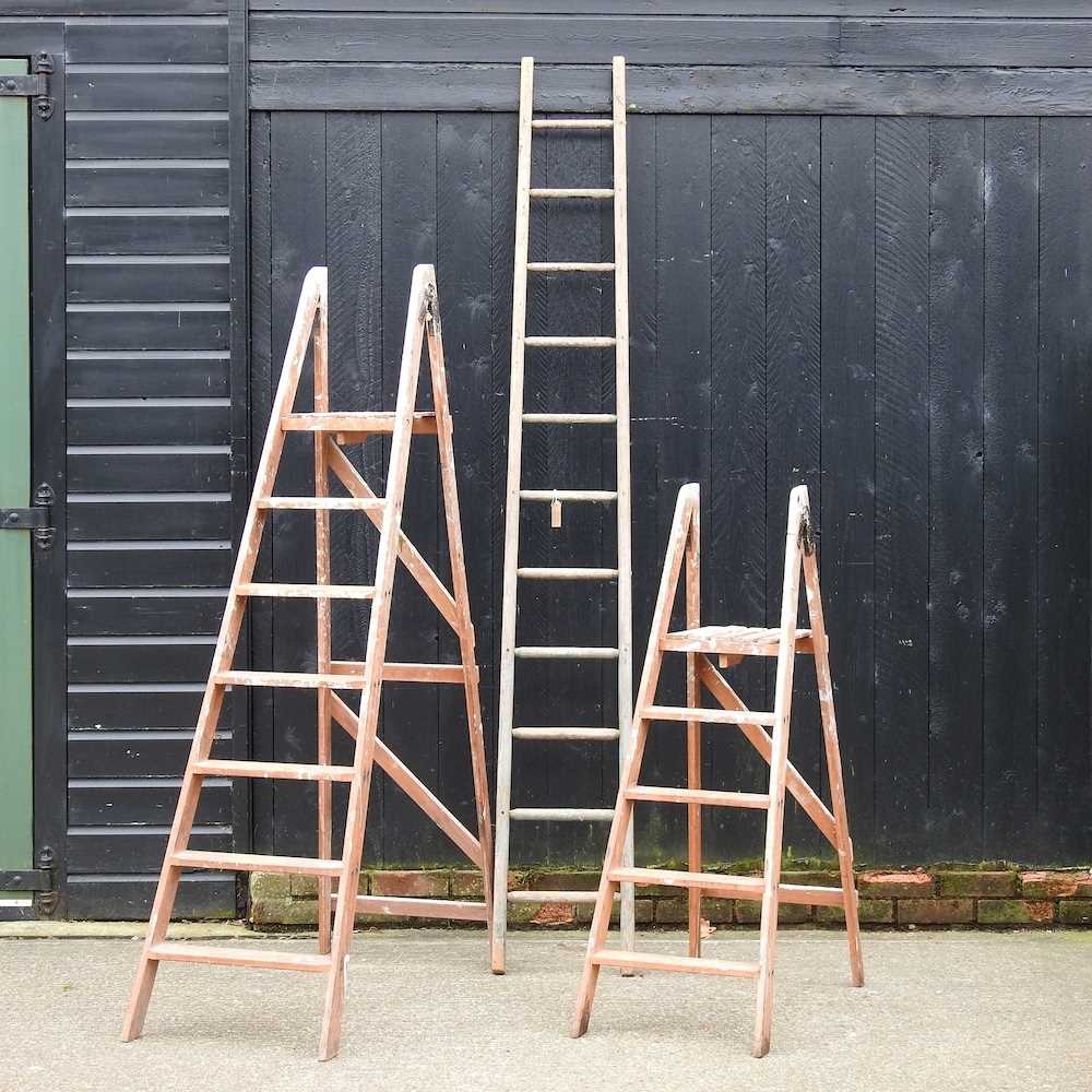 Lot 352 - A wooden ladder, together with two wooden