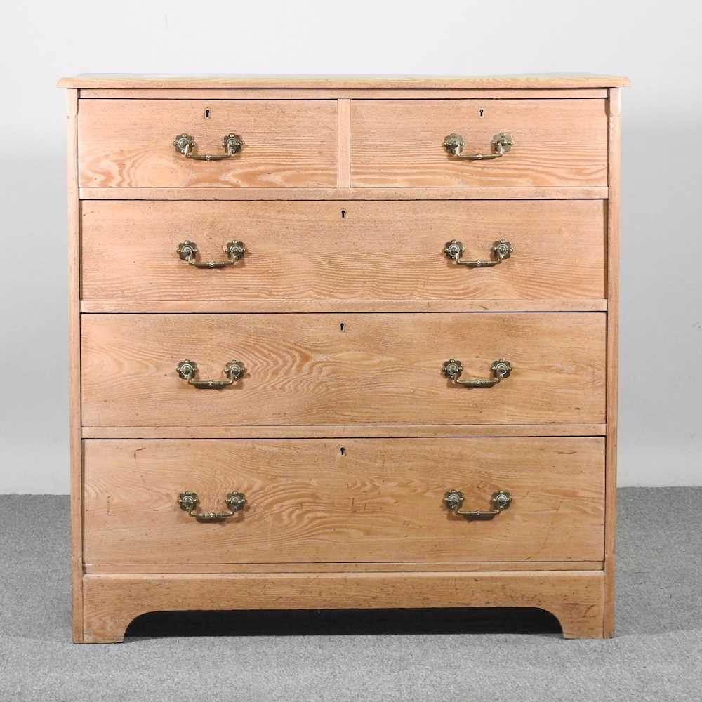 Lot 519 - An Edwardian light ash chest of drawers