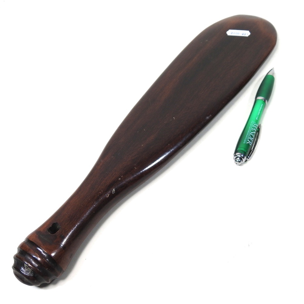 Lot 148 - A Maori hardwood short paddle, carved in low