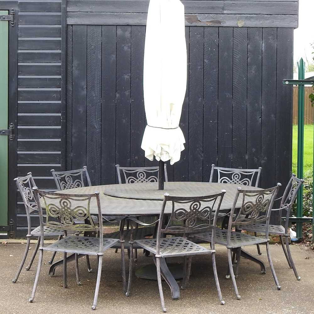Lot 488 - A large cast metal oval garden table,