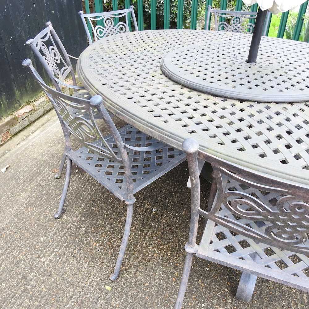 Lot 488 - A large cast metal oval garden table,