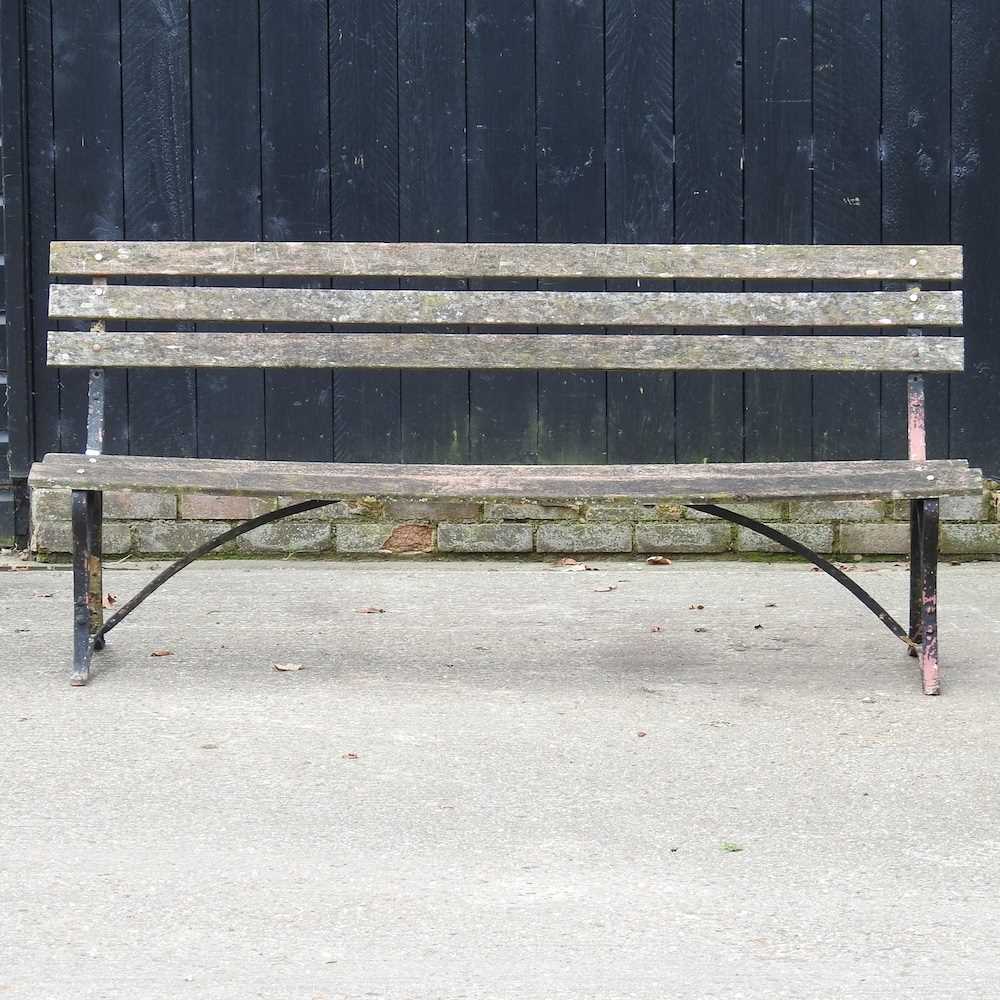 Lot 145 - A slatted garden bench, on painted iron