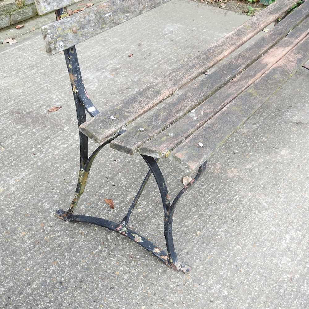 Lot 145 - A slatted garden bench, on painted iron