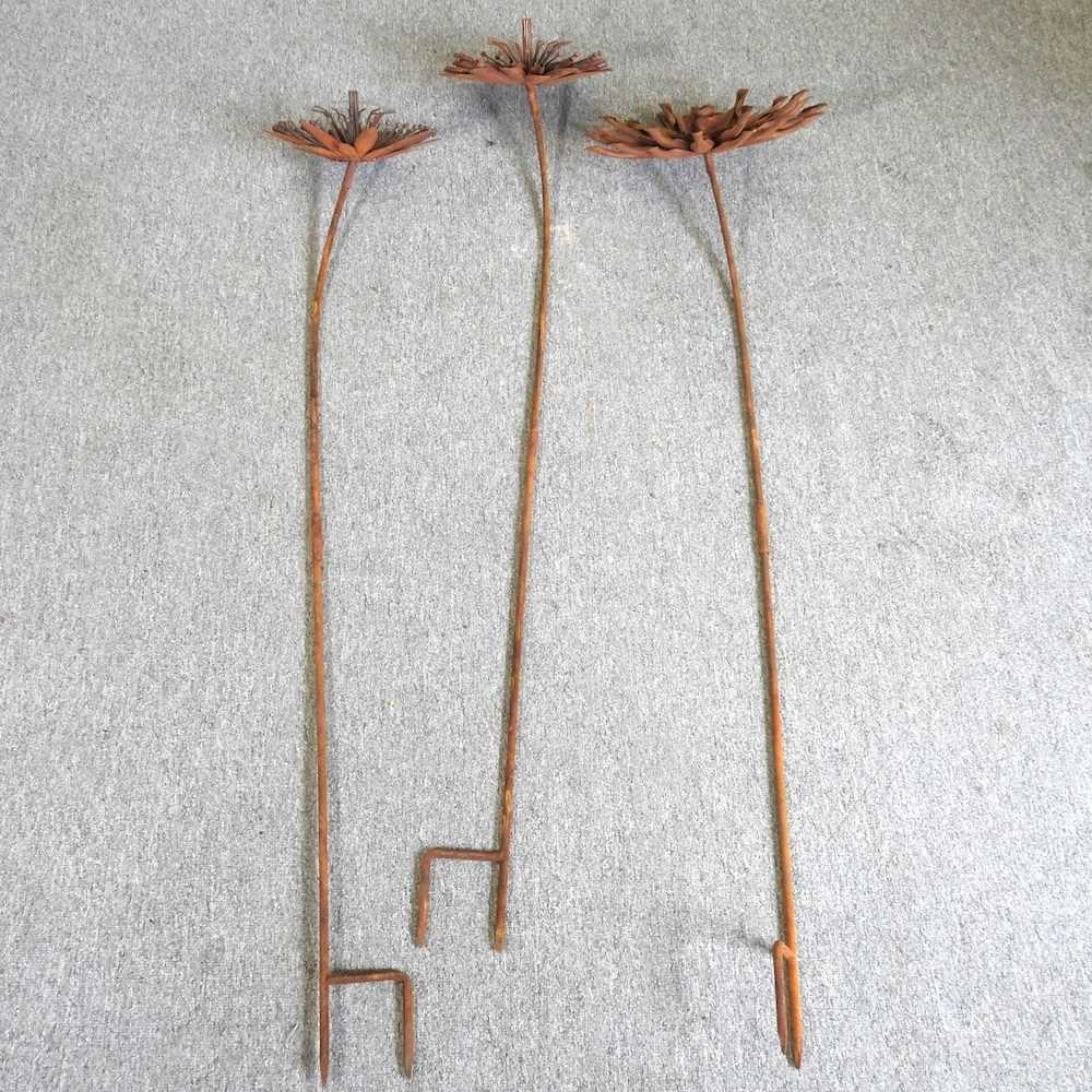Lot 420 - A set of three various rusted flower head