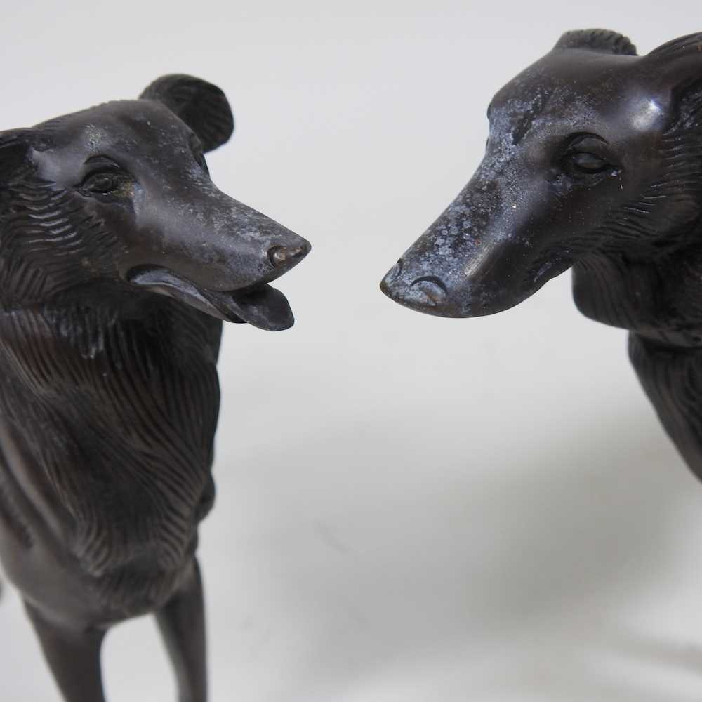 Lot 328 - A pair of small bronze models of greyhounds