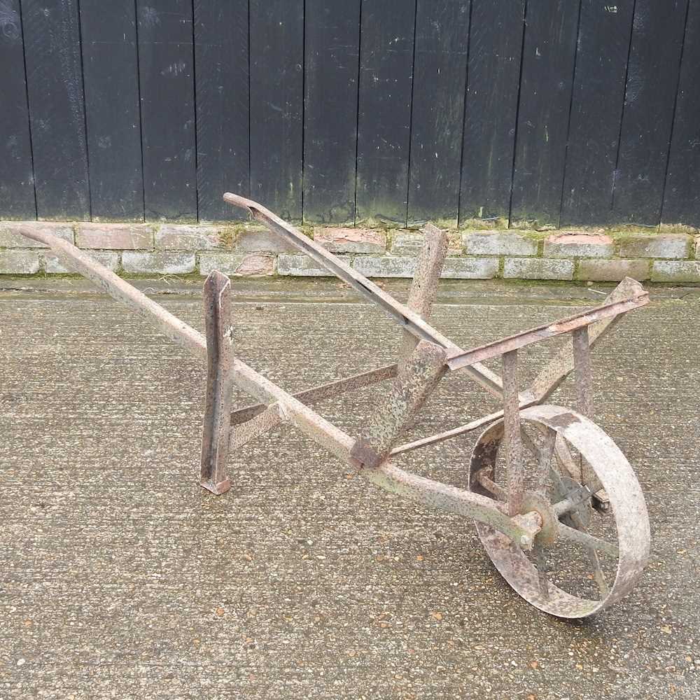 Lot 471 - An iron wheel barrow frame, 145cm long