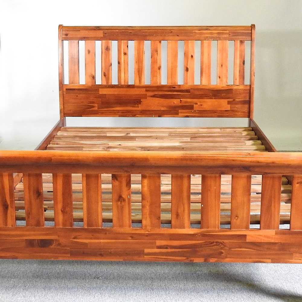 Lot 571 - A modern Morris Furniture double bedstead,
