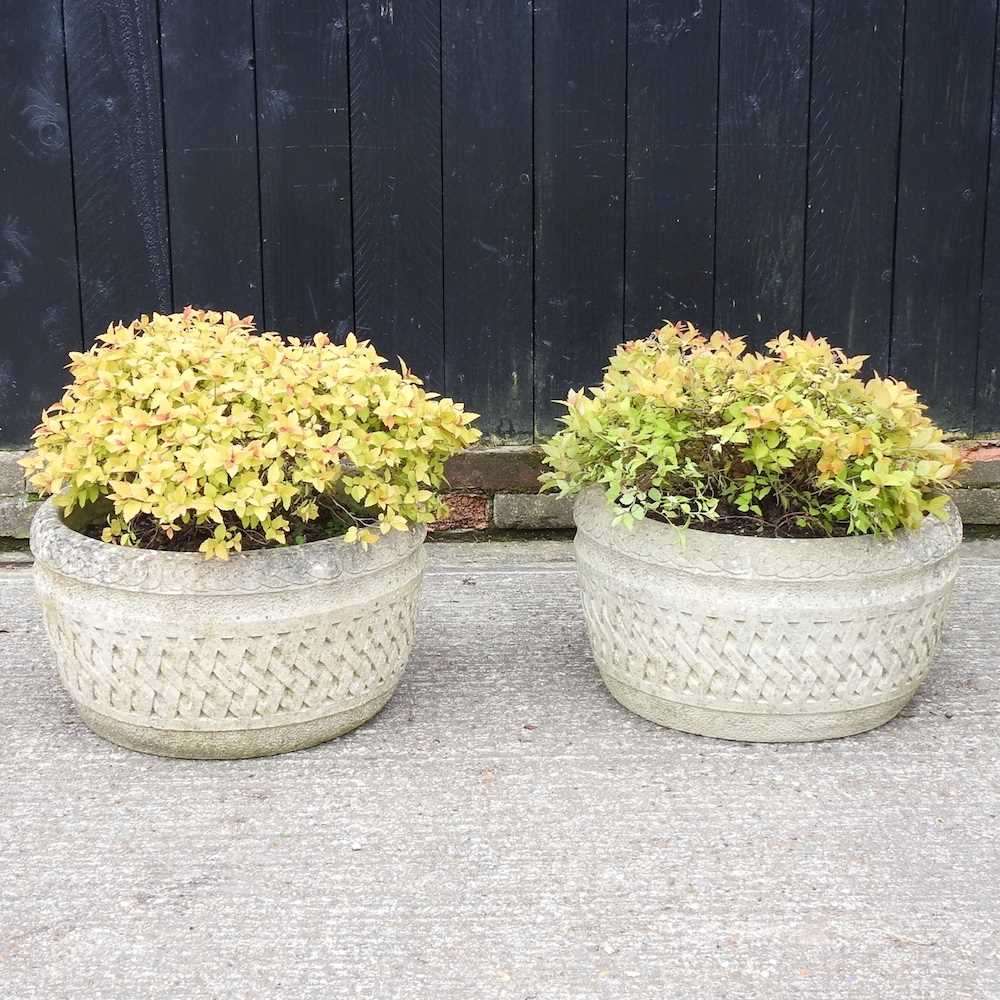 Lot 32 - A pair of cast stone garden pots, 50cm