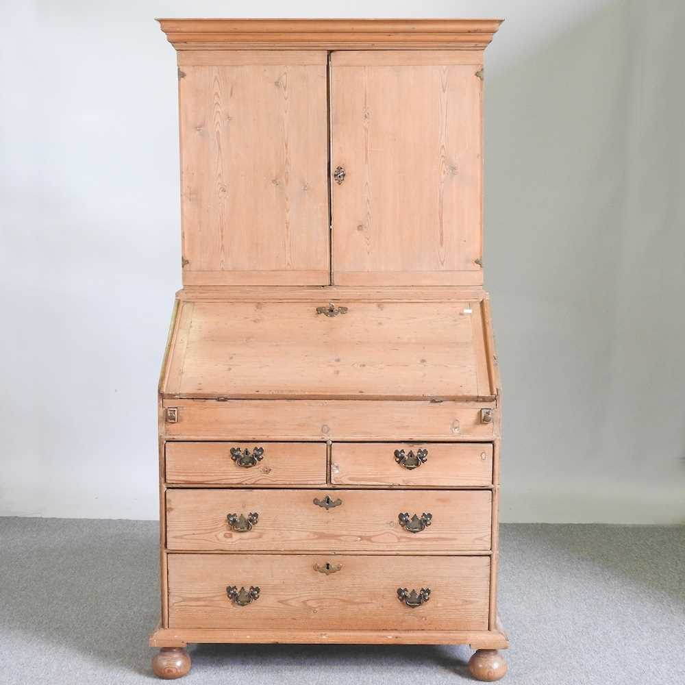 Lot 59 - A 19th century stripped pine bureau cabinet,