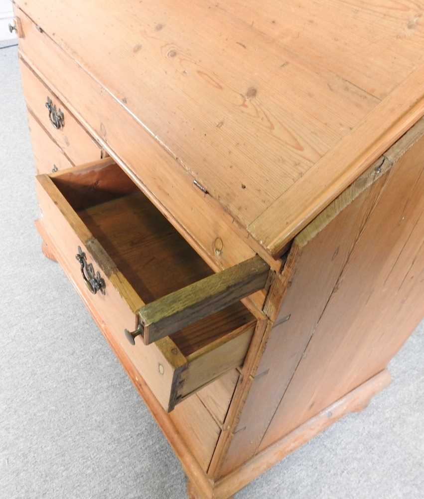 Lot 59 - A 19th century stripped pine bureau cabinet,