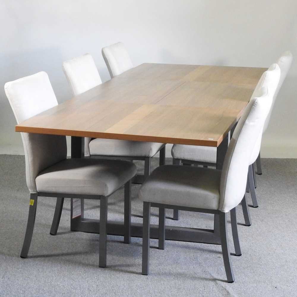 Lot 179 - A modern extending dining table on a metal