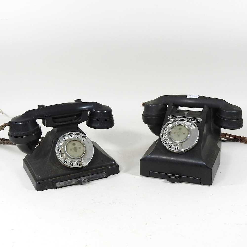 Lot 479 - A vintage black bakelite telephone, together