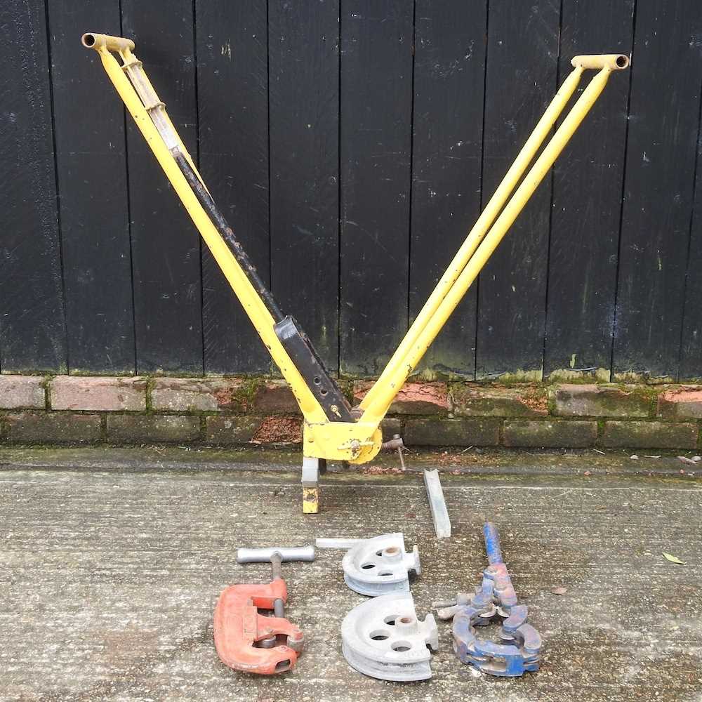 Lot 273 - A steel pipe bender, together with a clamp
