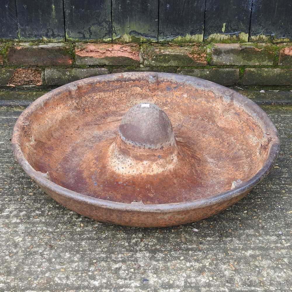 Lot 306 - A cast iron circular pig trough, 70cm