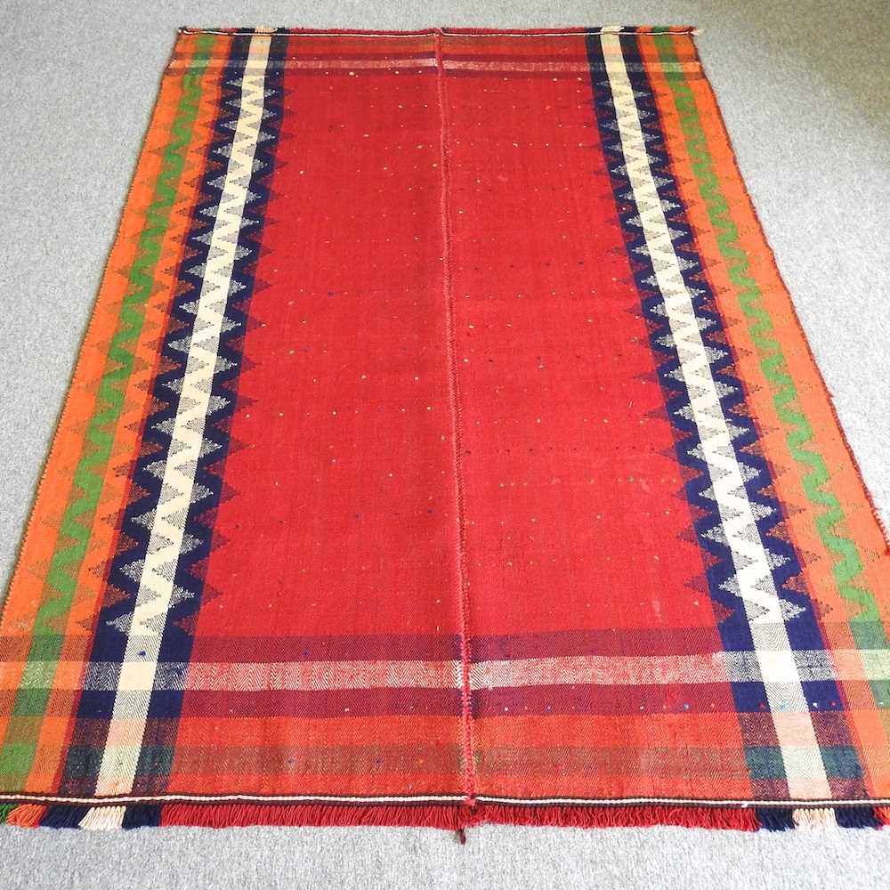 Lot 504 - A persian kelim rug, with zigzag designs, on