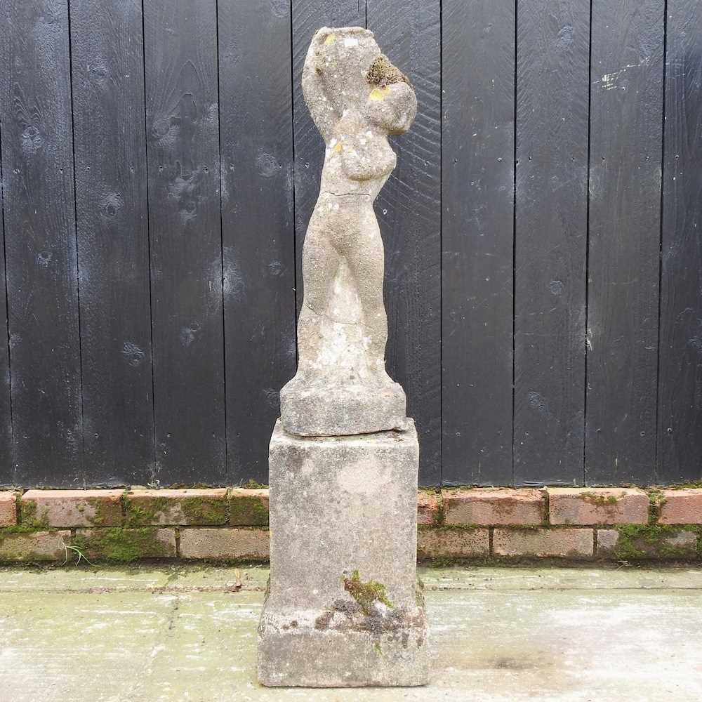 Lot 246 - A cast stone garden statute of a figure,