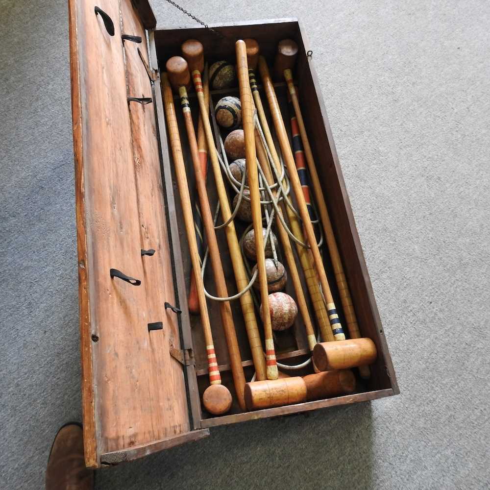 Lot 12 - An early 20th century Ayres croquet set, in a